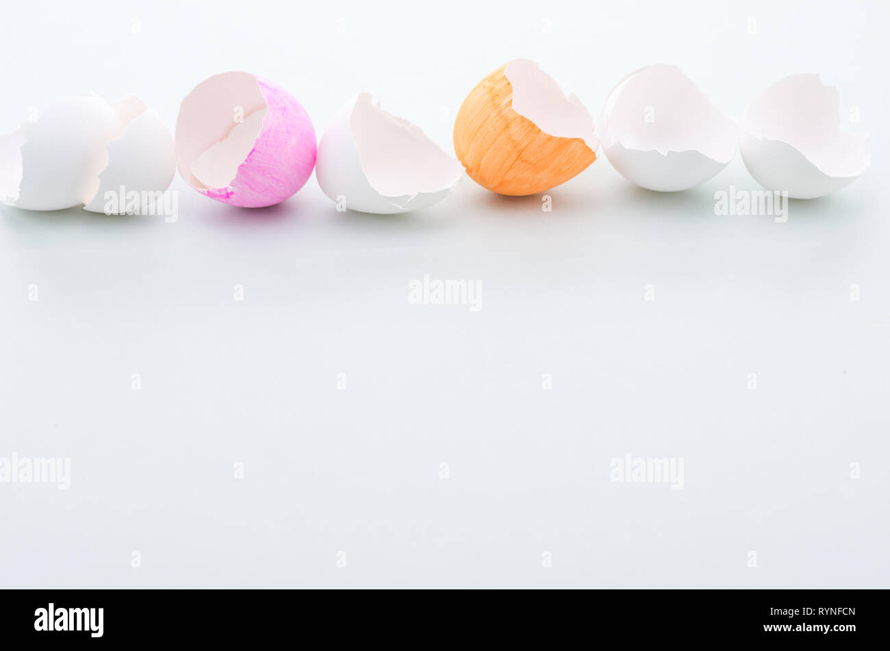 white empty broken egg shells with colored ones Stock Photo - Alamy