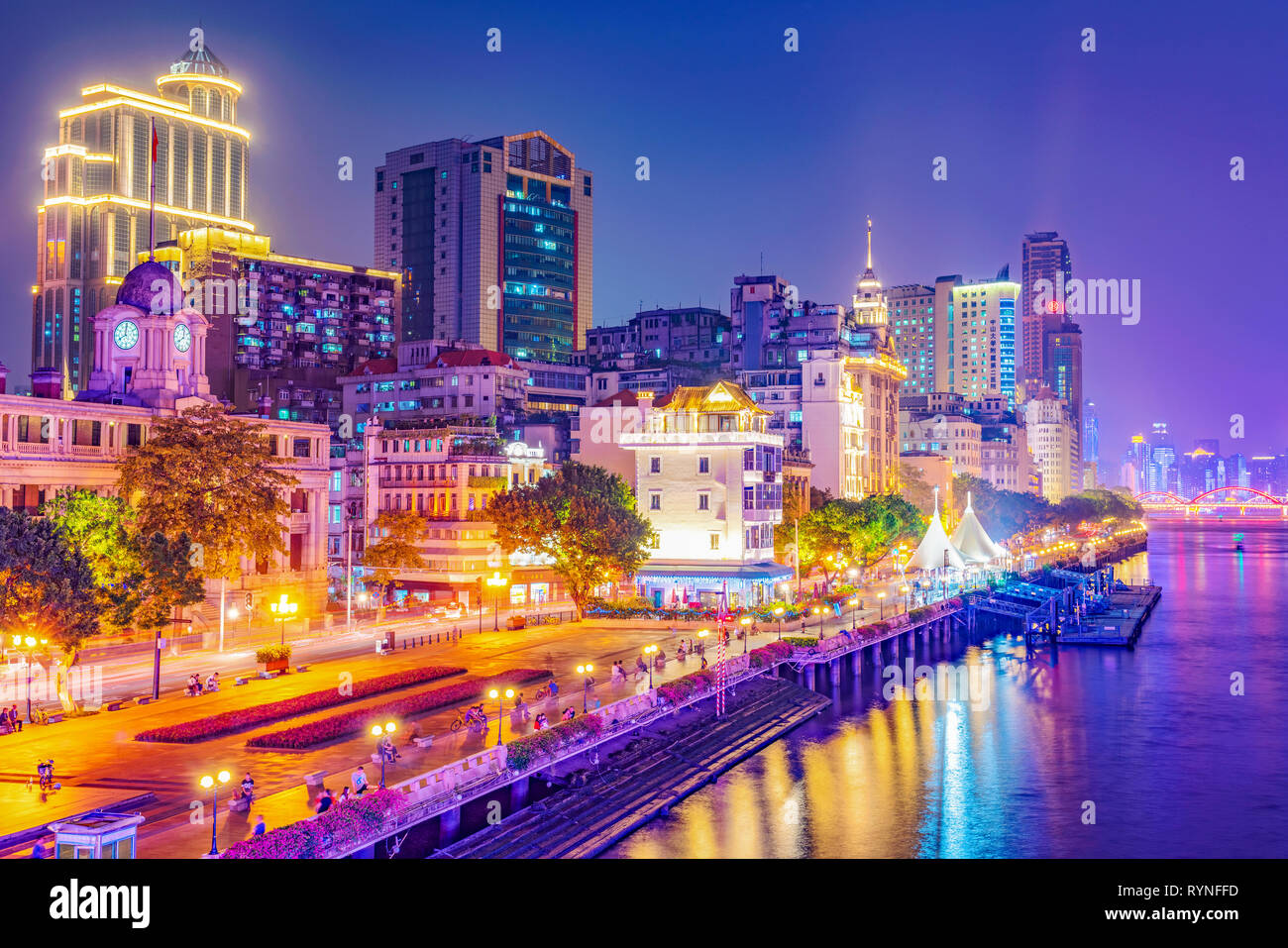 GUANGZHOU, CHINA - OCTOBER 25: Night view of riverside high rise city ...