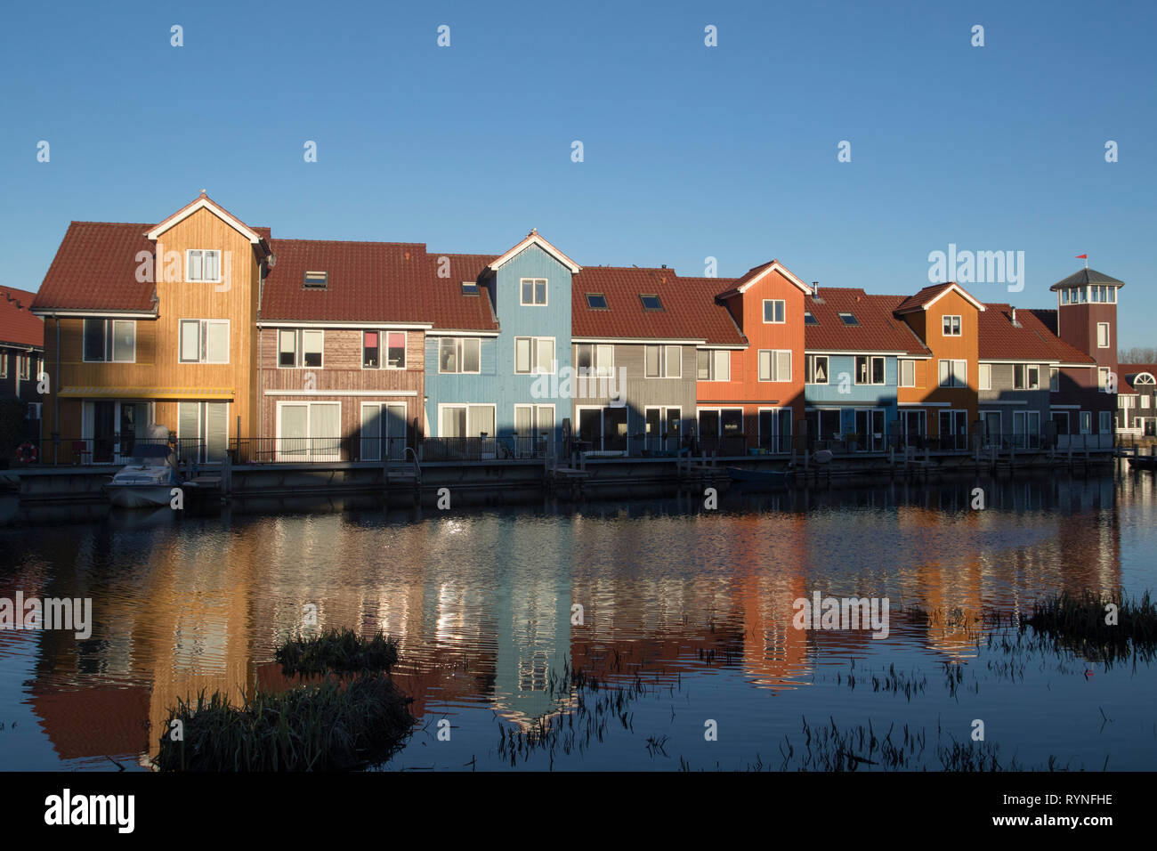 Colorful houses reitdiephaven harbor hi-res stock photography and ...