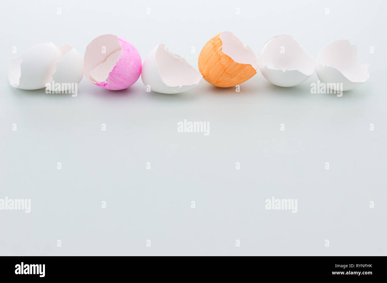white empty broken egg shells with colored ones Stock Photo - Alamy