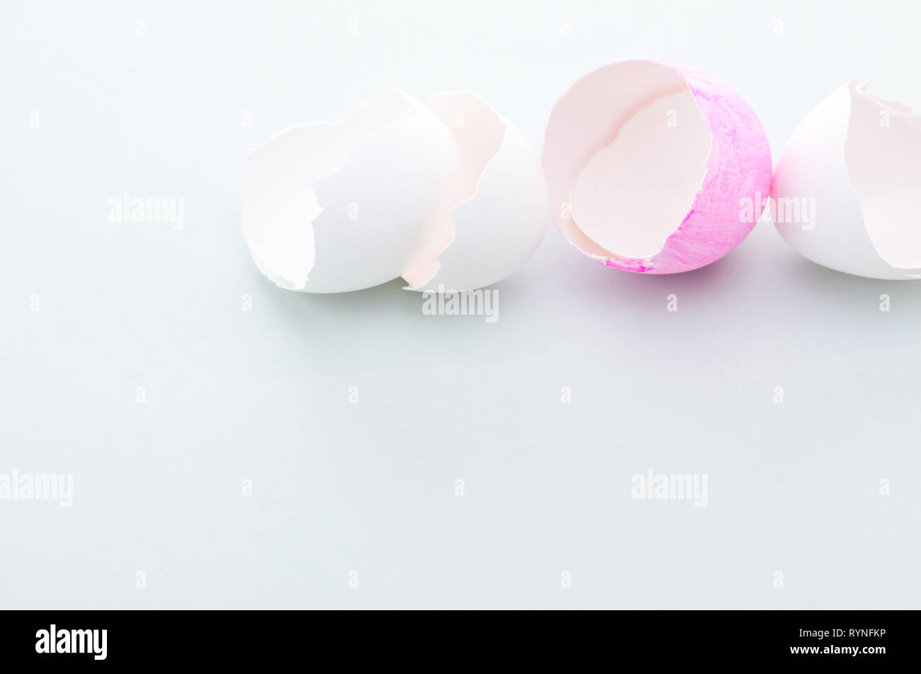 white empty broken egg shells with colored ones Stock Photo - Alamy