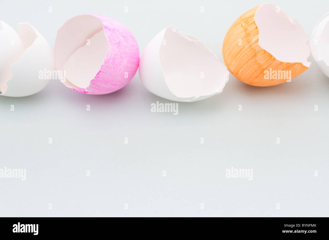 white empty broken egg shells with colored ones Stock Photo - Alamy