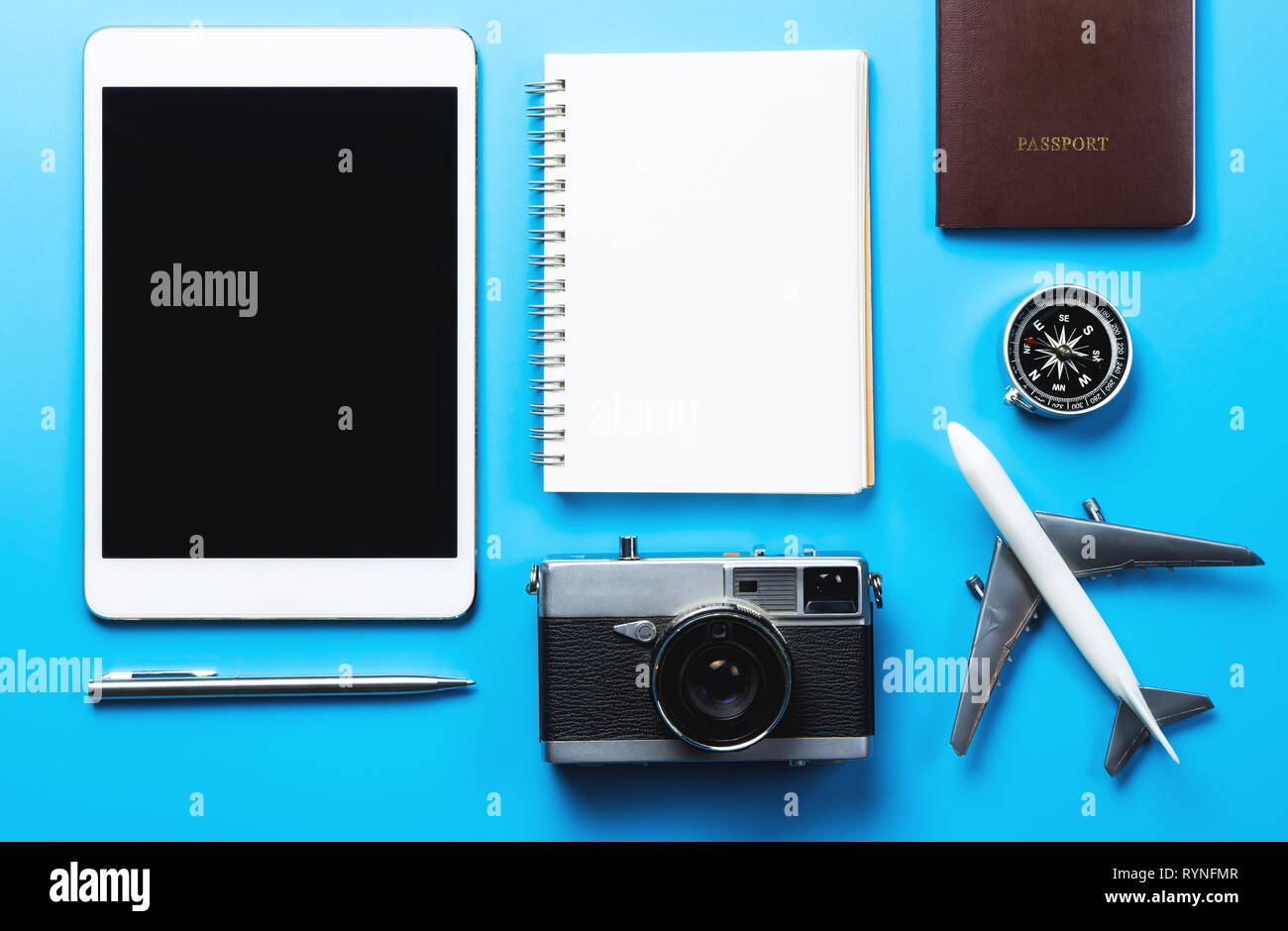 travel blogger writing equipment on blue background Stock Photo - Alamy