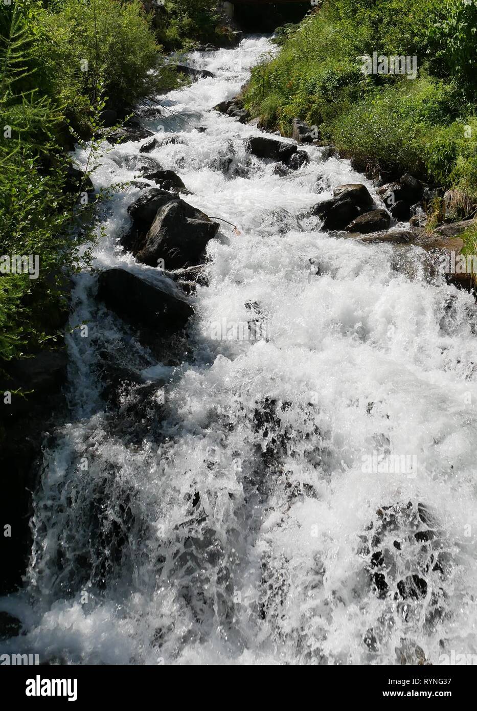 Fast flowing mountain stream in the Ahrntal Valley Italy Stock Photo ...