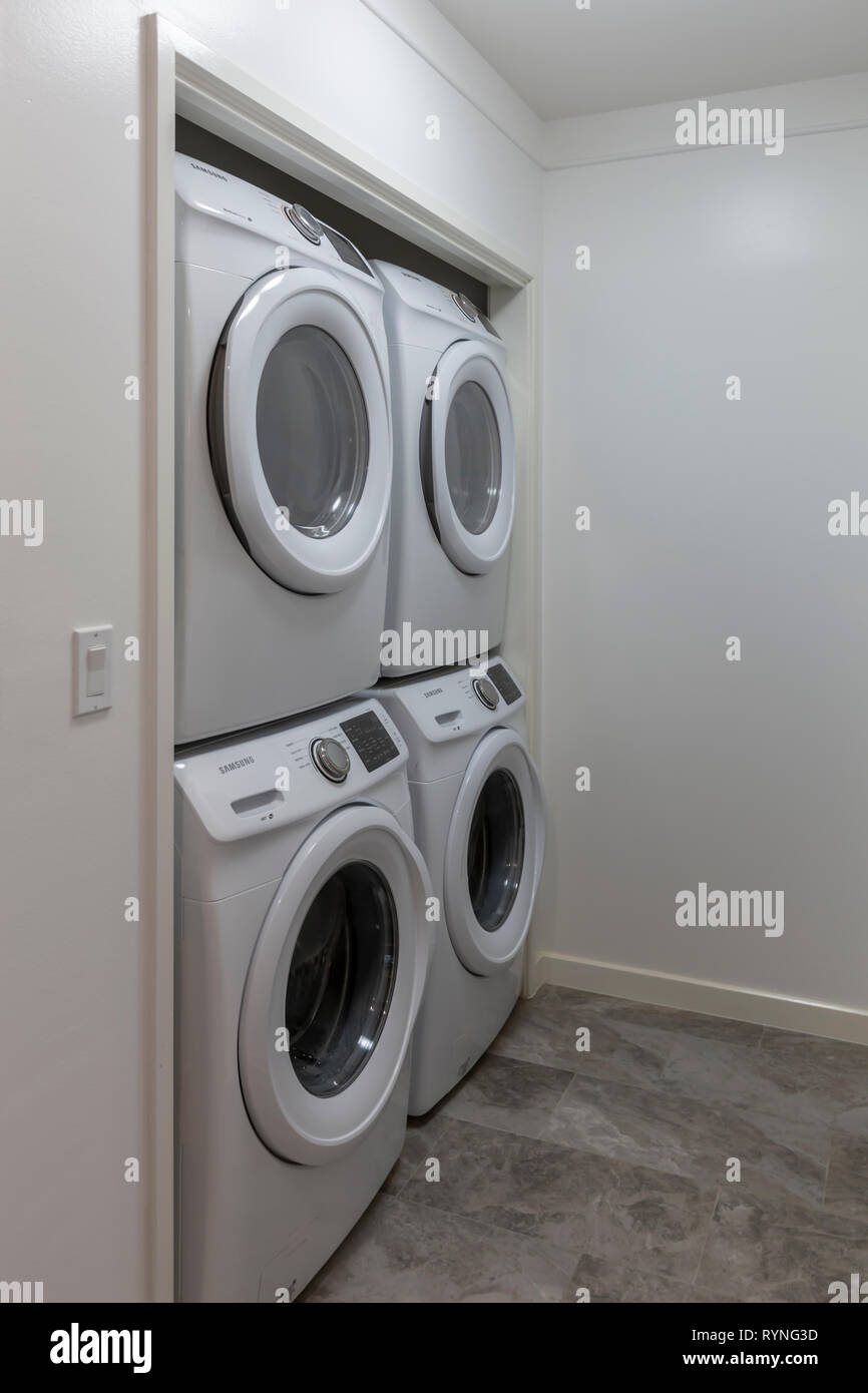 Laundry room interior washer and dryer Stock Photo - Alamy