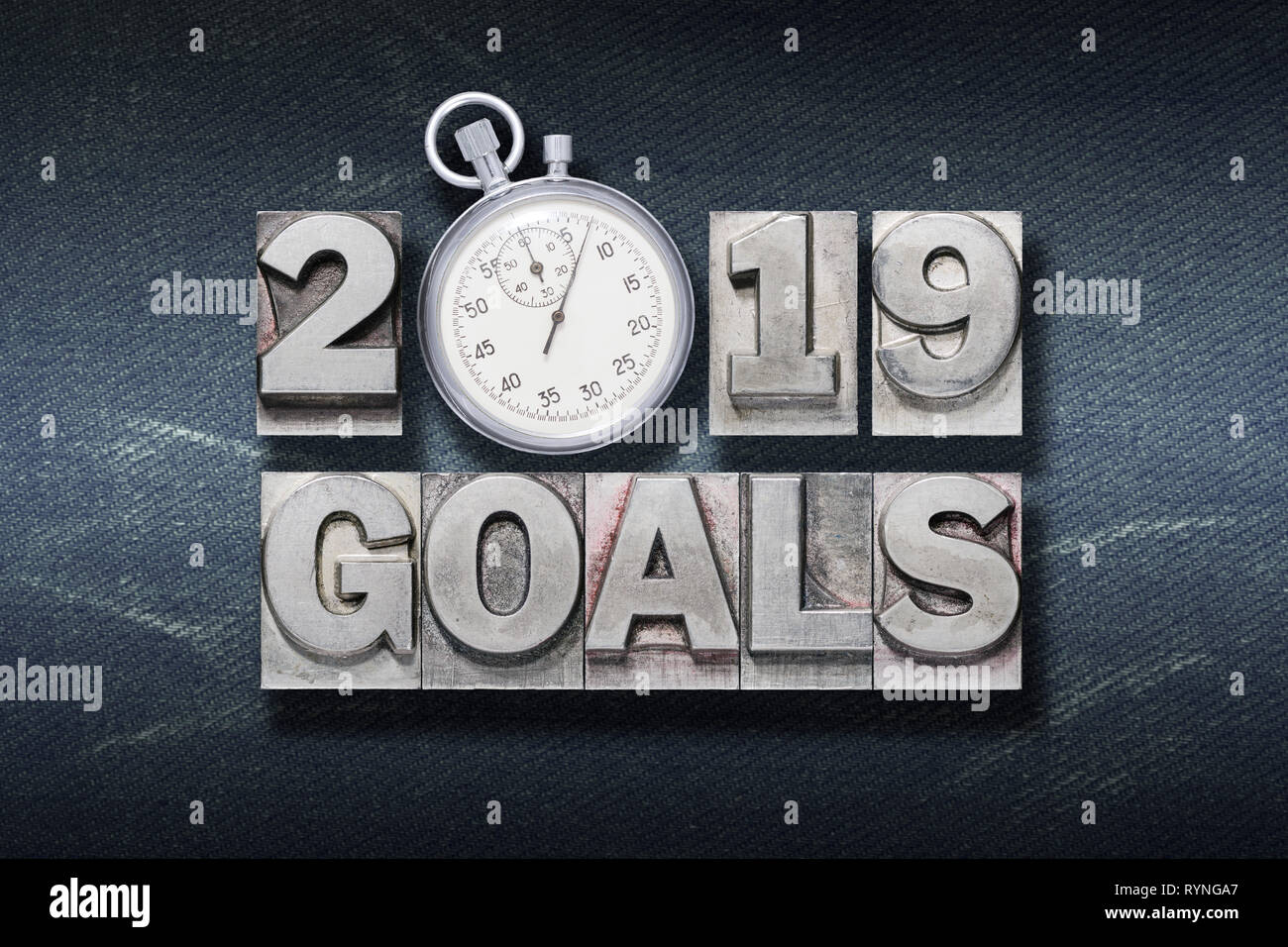2019 goals phrase made from metallic letterpress with stopwatch instead ...