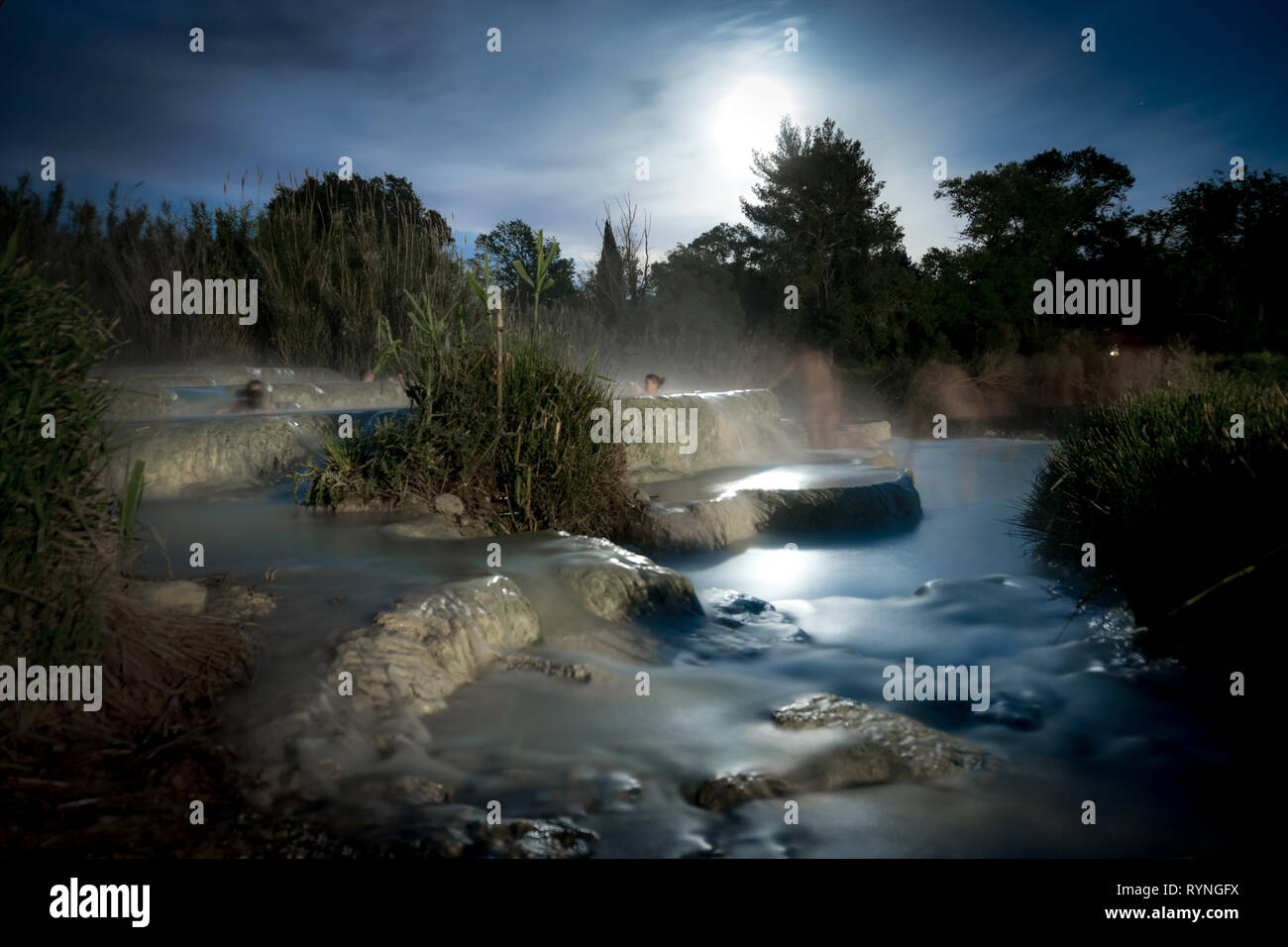 Night view of the famous free spa of the mill in Saturnia in Tuscany ...