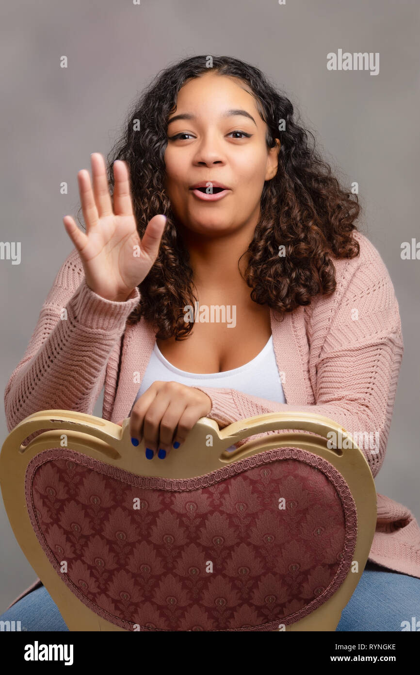 Positive, fun, happy attitude. Extremely happy young lady with curly ...