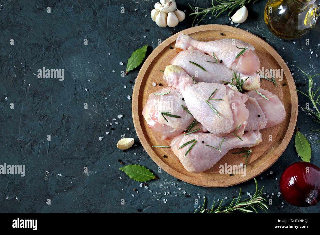 Raw uncooked chicken legs with ingredients for cooking, drumsticks on ...