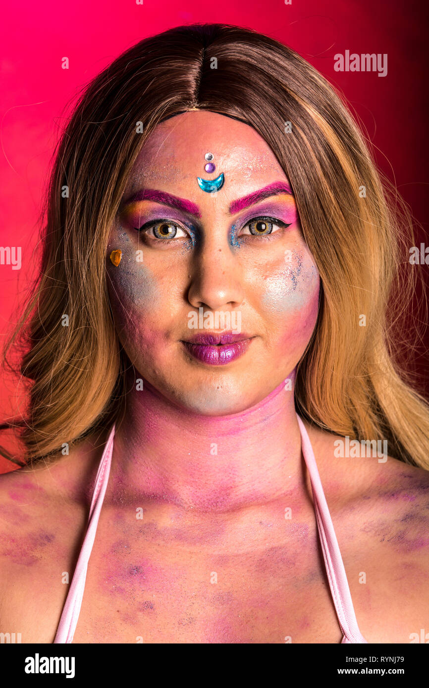 A young woman, mid 20's, wearing a wig and makeup Stock Photo - Alamy