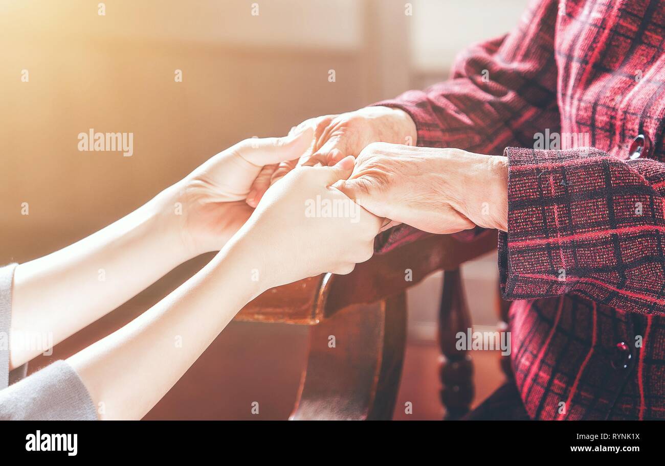 Teenage asia young girl carer holding grandma hands, concept of helping ...