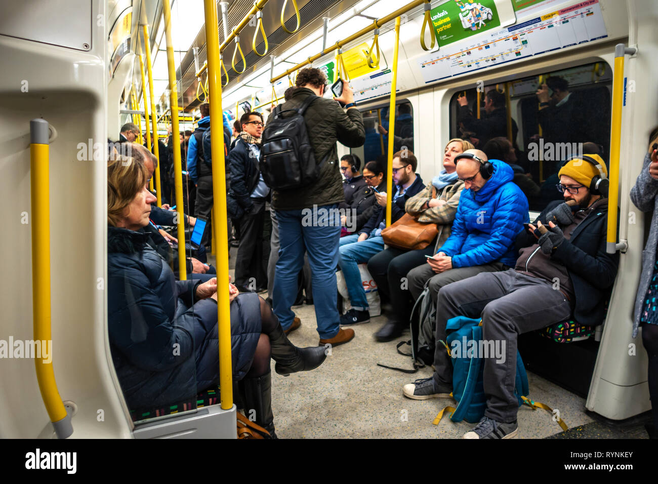 Man reading newspaper on train hi-res stock photography and images - Alamy
