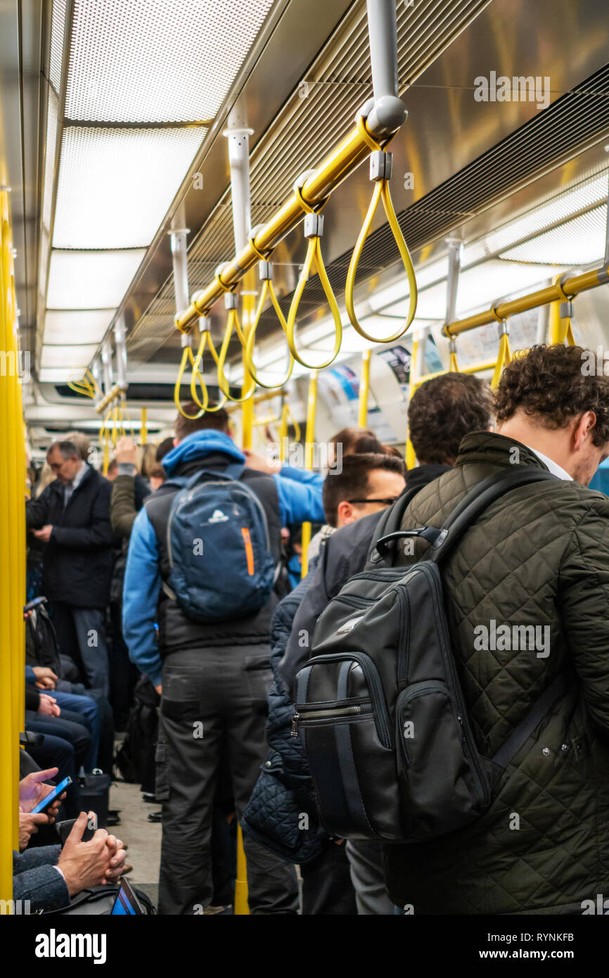Tube commuters time, commuters reading and using smartphones on the ...