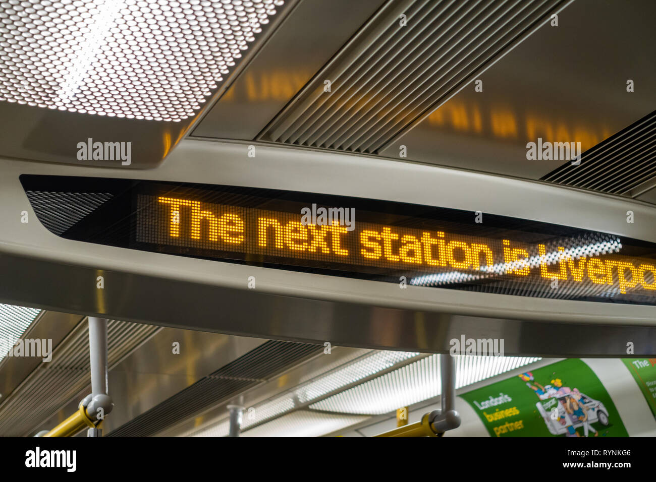 The Next Station is destination Information sign above the heads of ...