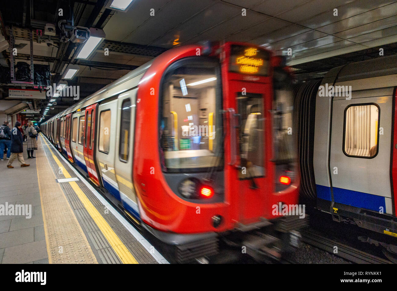 London Tube train leaves the platform at a quiet travel time, after the ...