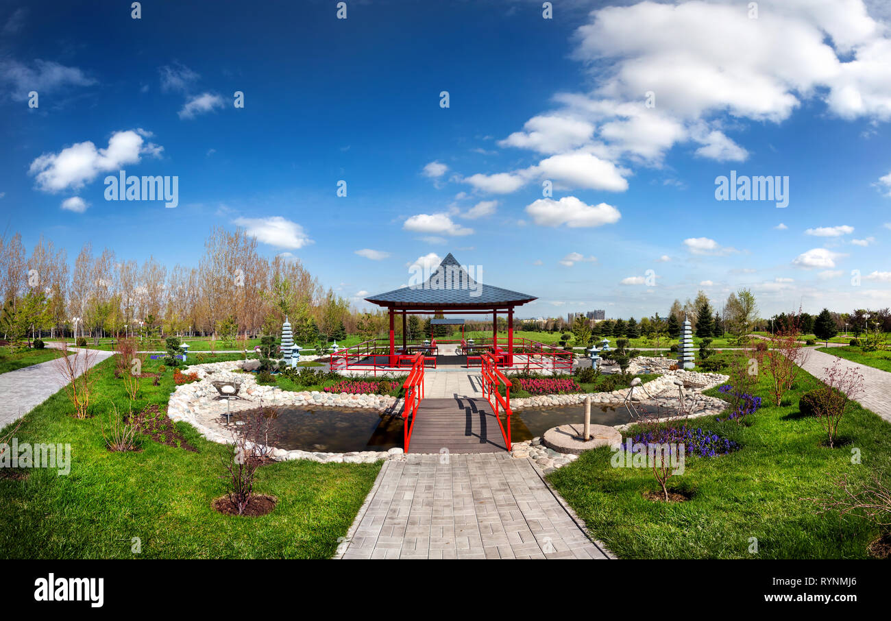 Japanese garden with red pagoda and blue sky in dendra park of first ...