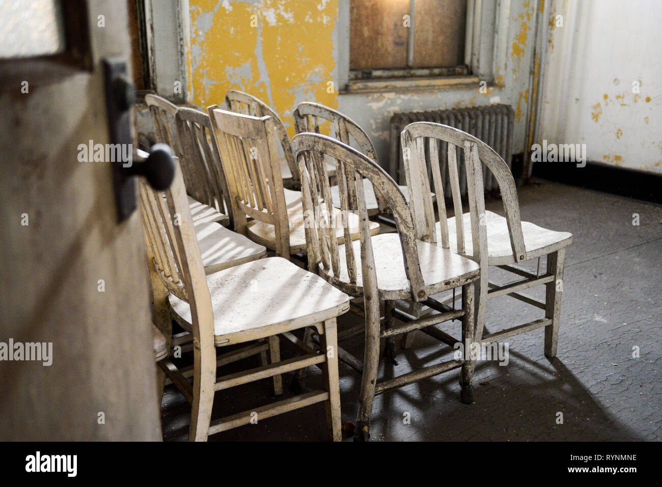 Interior of Decaying Structure Showing Stacked Chairs Stock Photo - Alamy