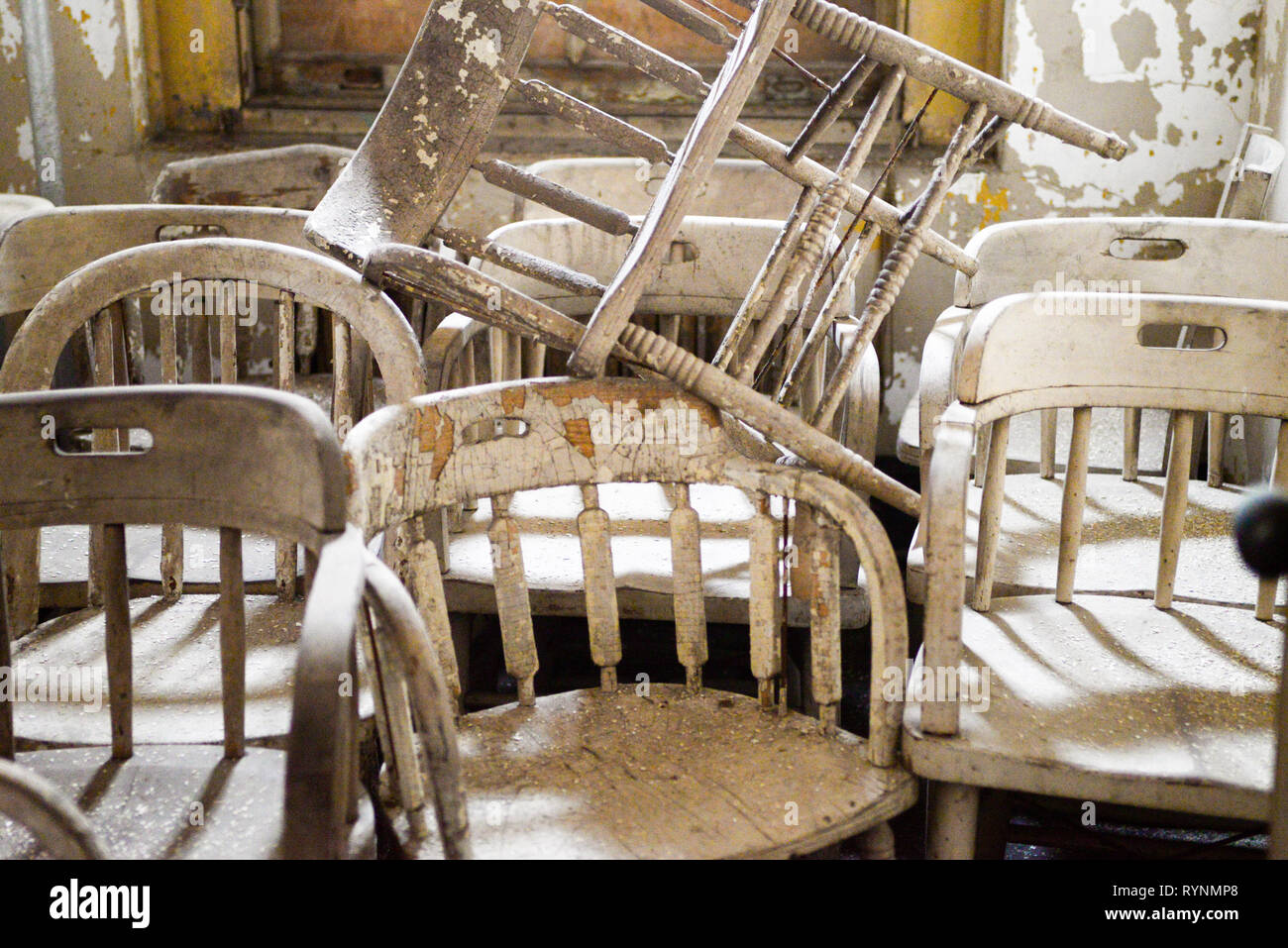 Interior of Decaying Structure Showing Stacked Chairs Stock Photo - Alamy