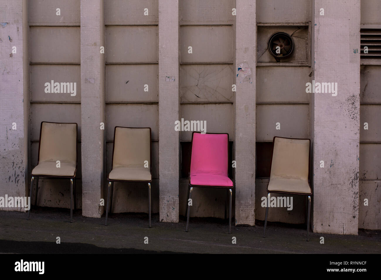 Four chairs and one is unique Stock Photo - Alamy