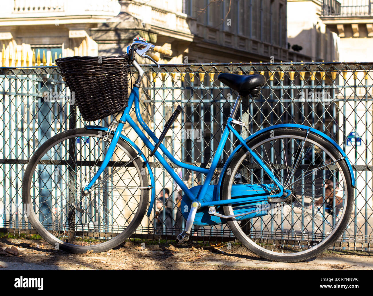 blue bicycle at the fence Stock Photo - Alamy