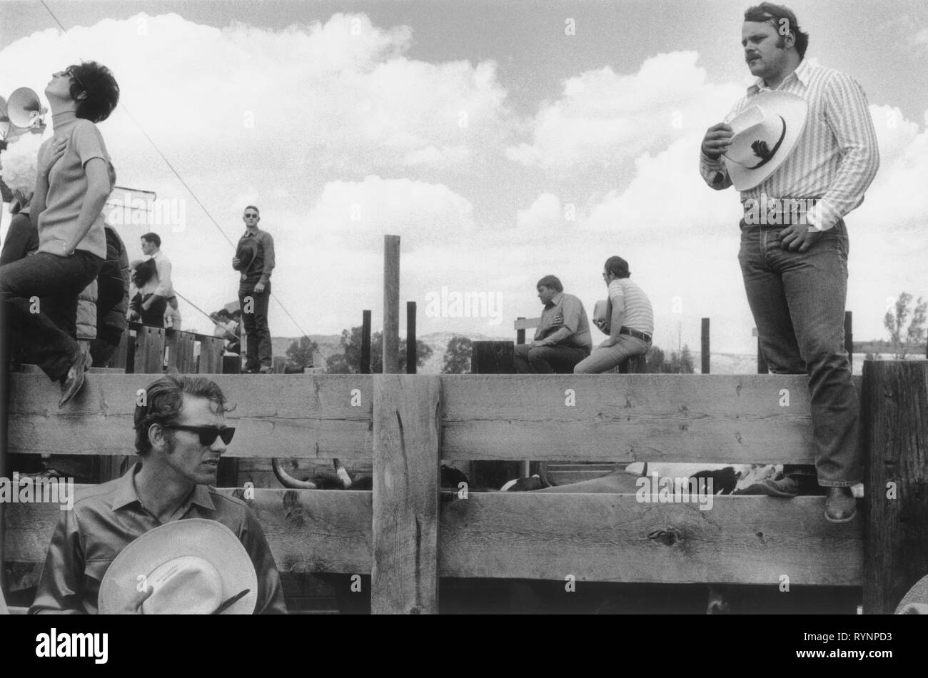 Rodeo 1970s Young patriotic Americans take off their hats during the ...