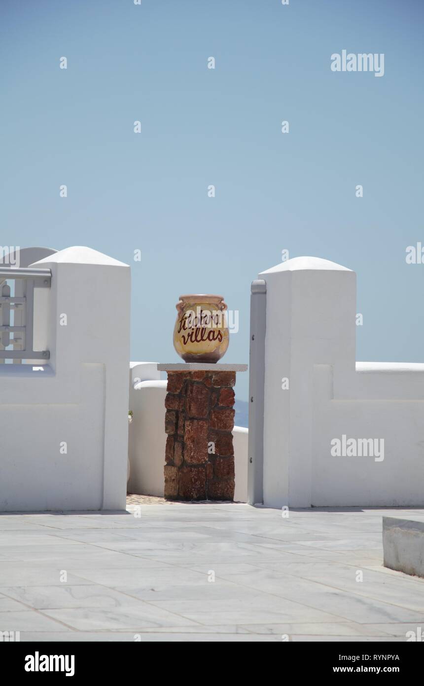 Santorini village golden pot view Oia Stock Photo - Alamy