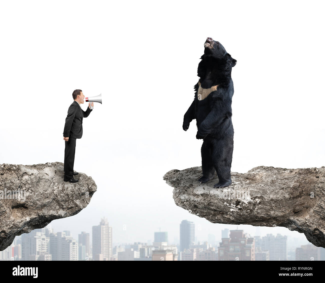 Businessman using megaphone yelling at black bear on cliff with ...