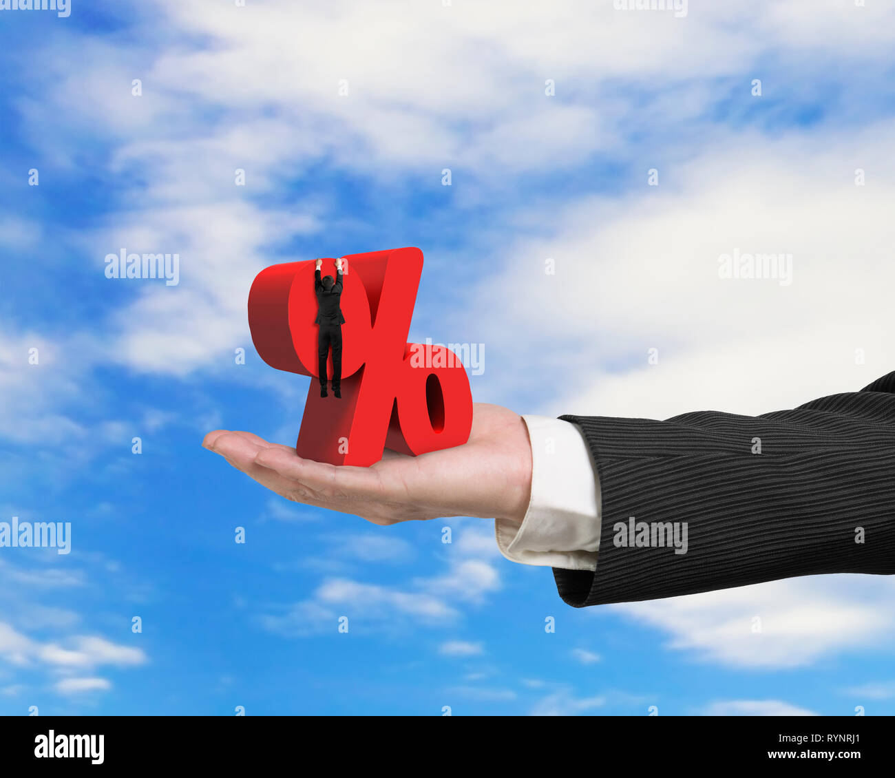 Hand showing businessman hanging on 3D red percentage sign with sky ...