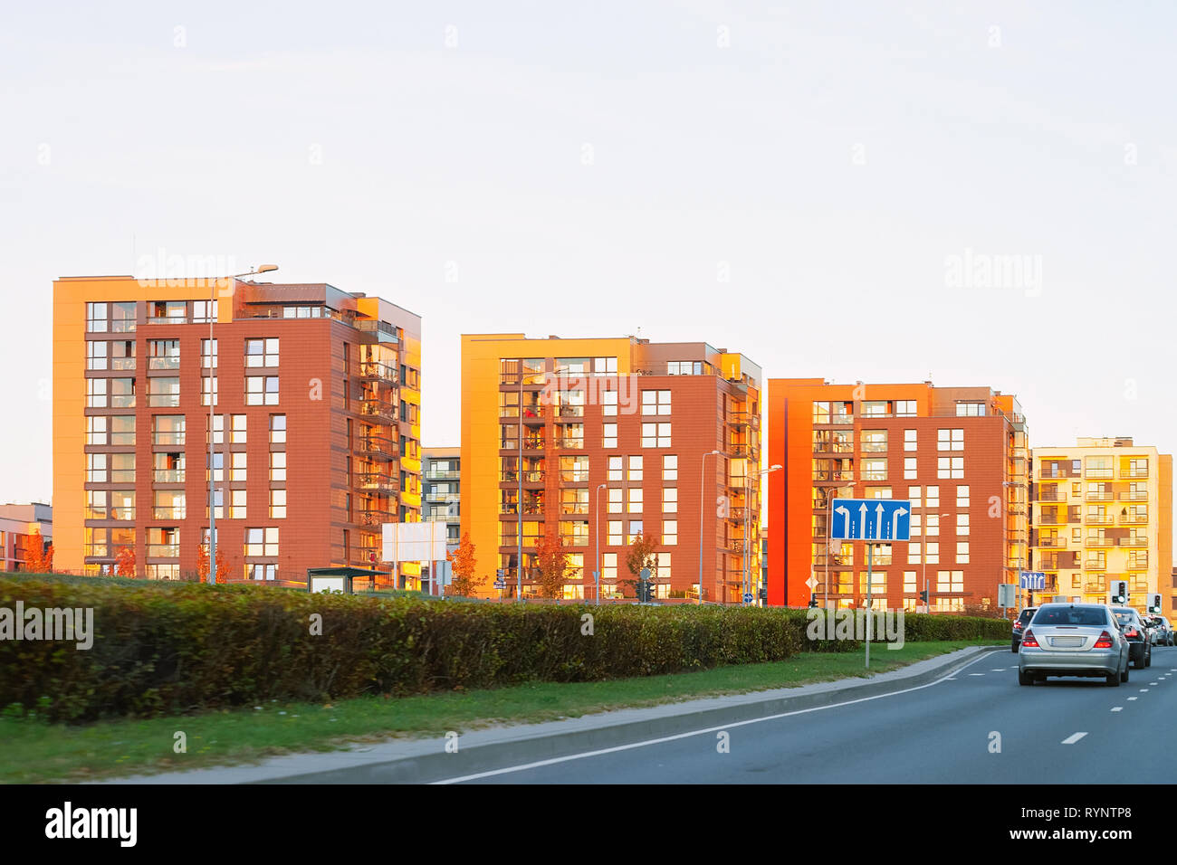 Cars in the road and Apartment house residential building complex Stock ...