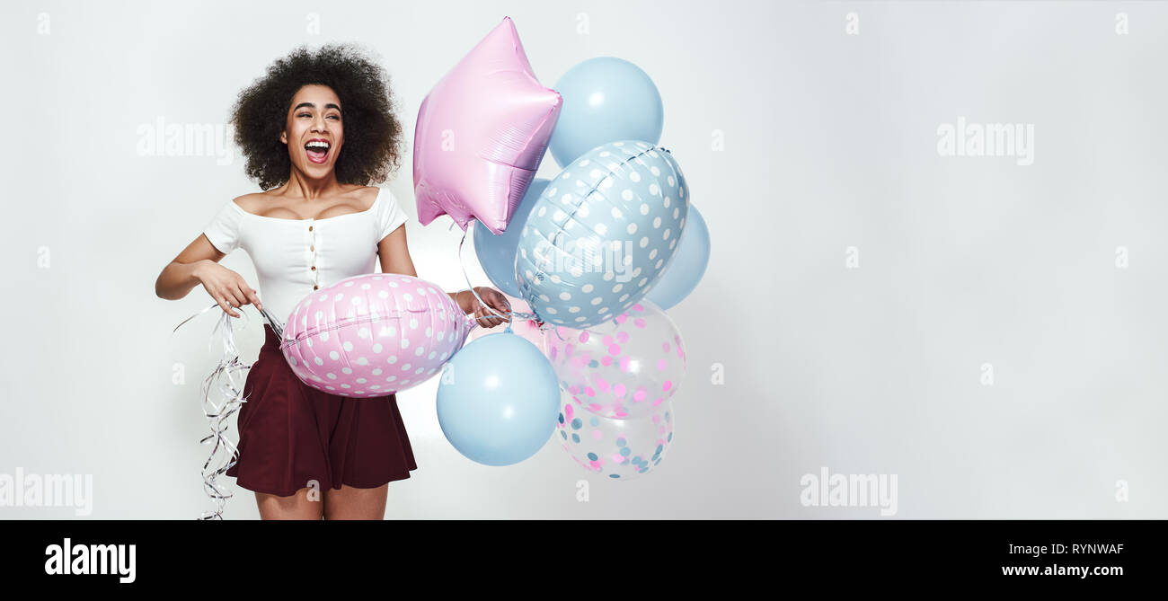Happy birthday! Positive young afro american woman with curly hair is ...