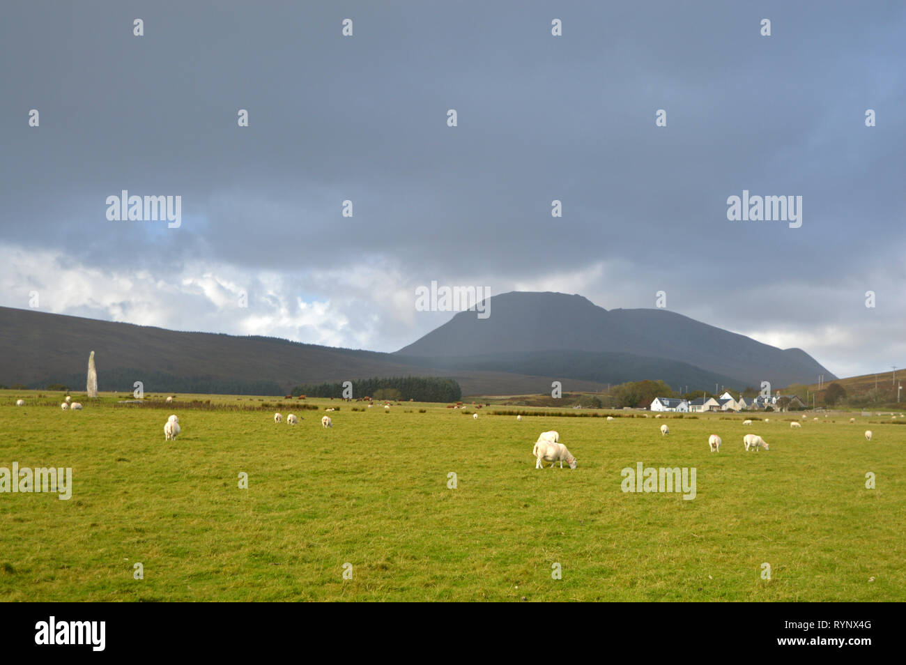 Auchencar standing stone and Beinn Bharrain Isle of Arran Stock Photo ...