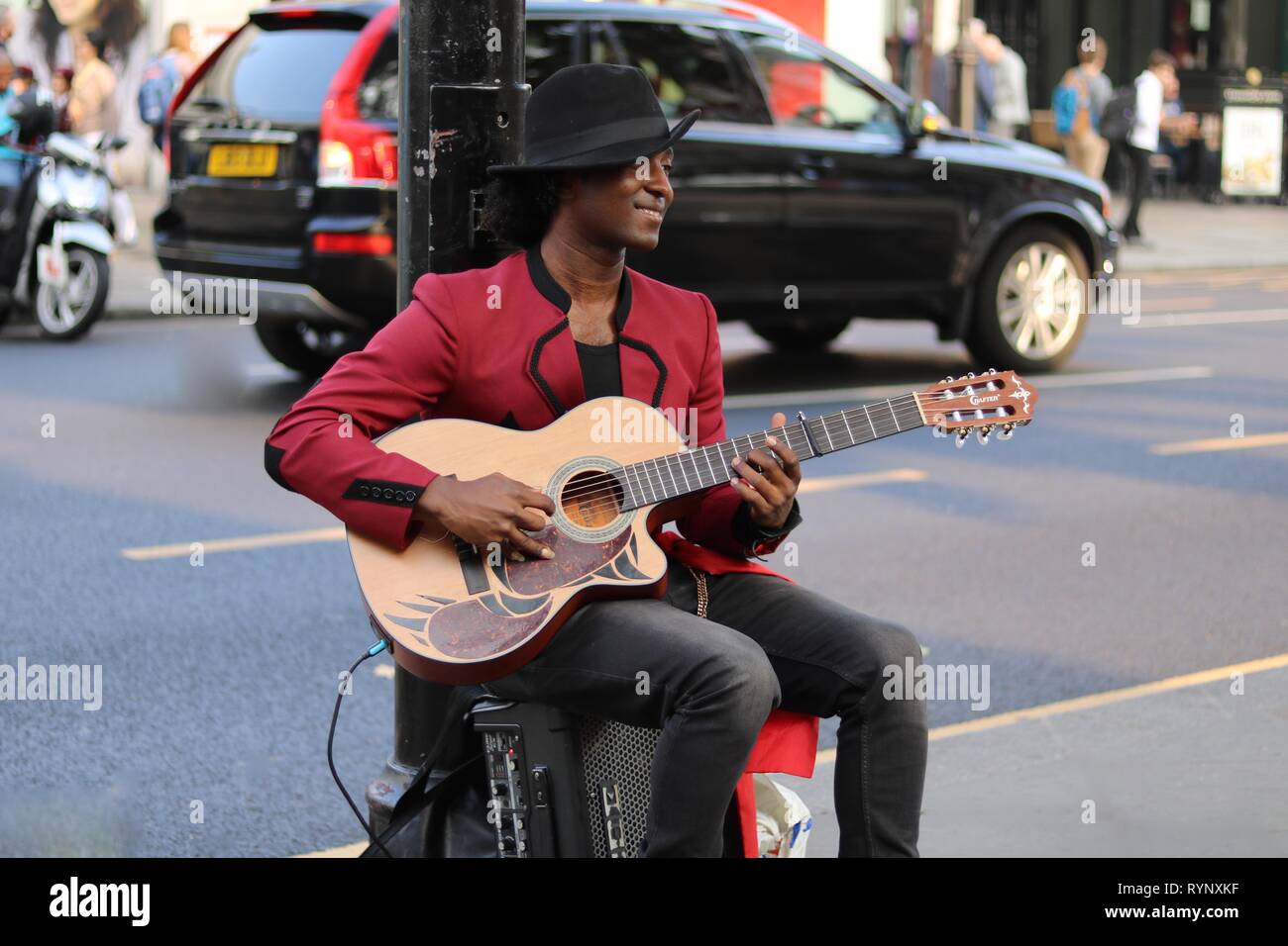Black busker hi-res stock photography and images - Alamy