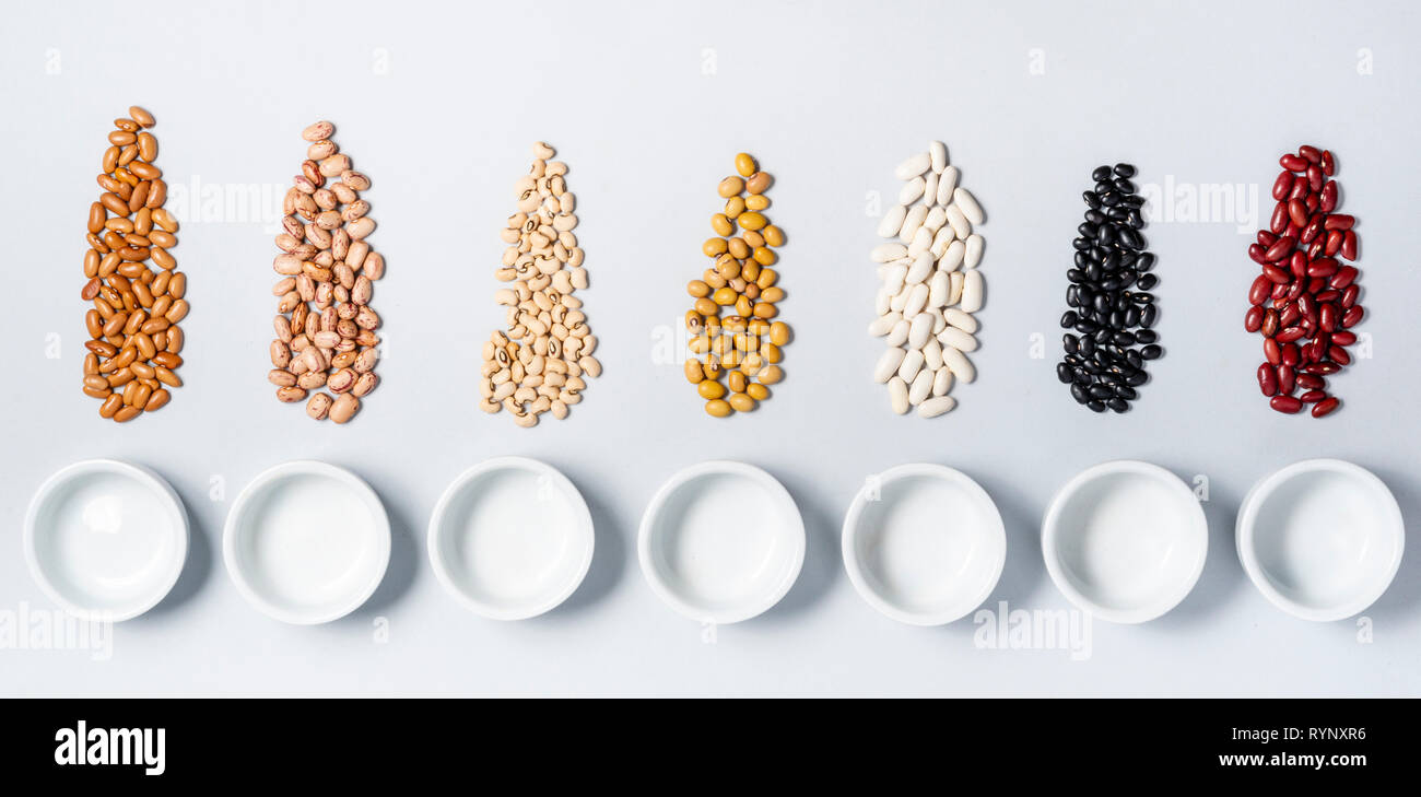 Varieties of beans on gray background Stock Photo - Alamy