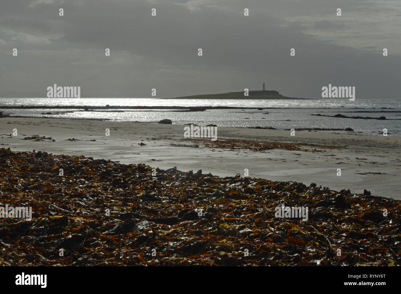 Pladda lighthouse viewed from Kildonan beach on the southern tip Of ...