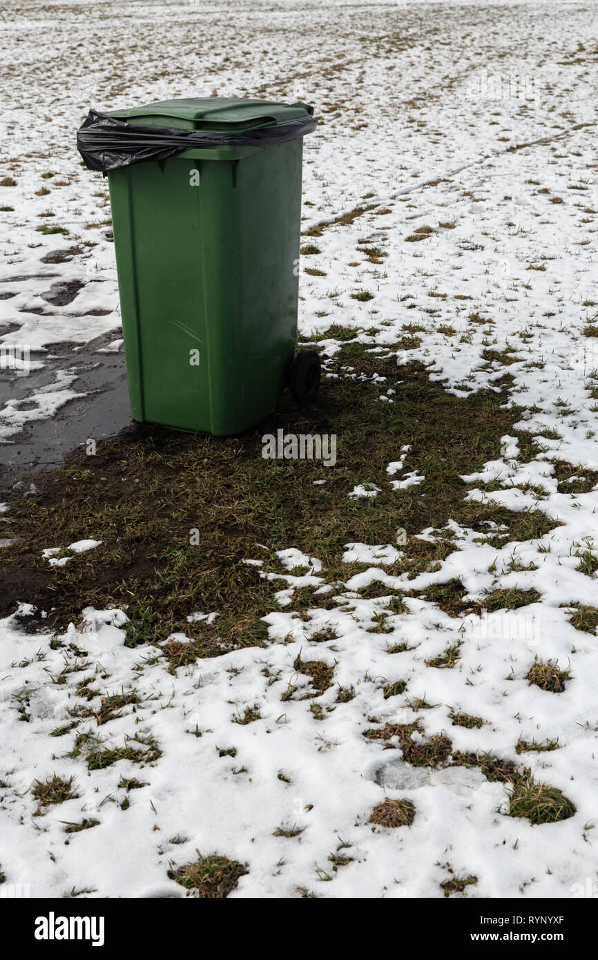 Blank ad space trash can standing in a picnic field in Winter Stock ...