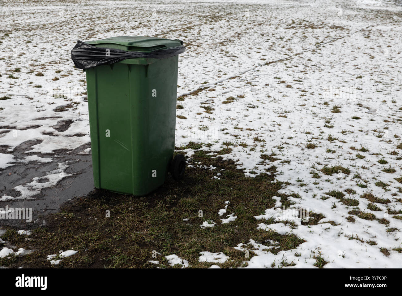Blank ad space trash can standing in a picnic field in Winter Stock ...
