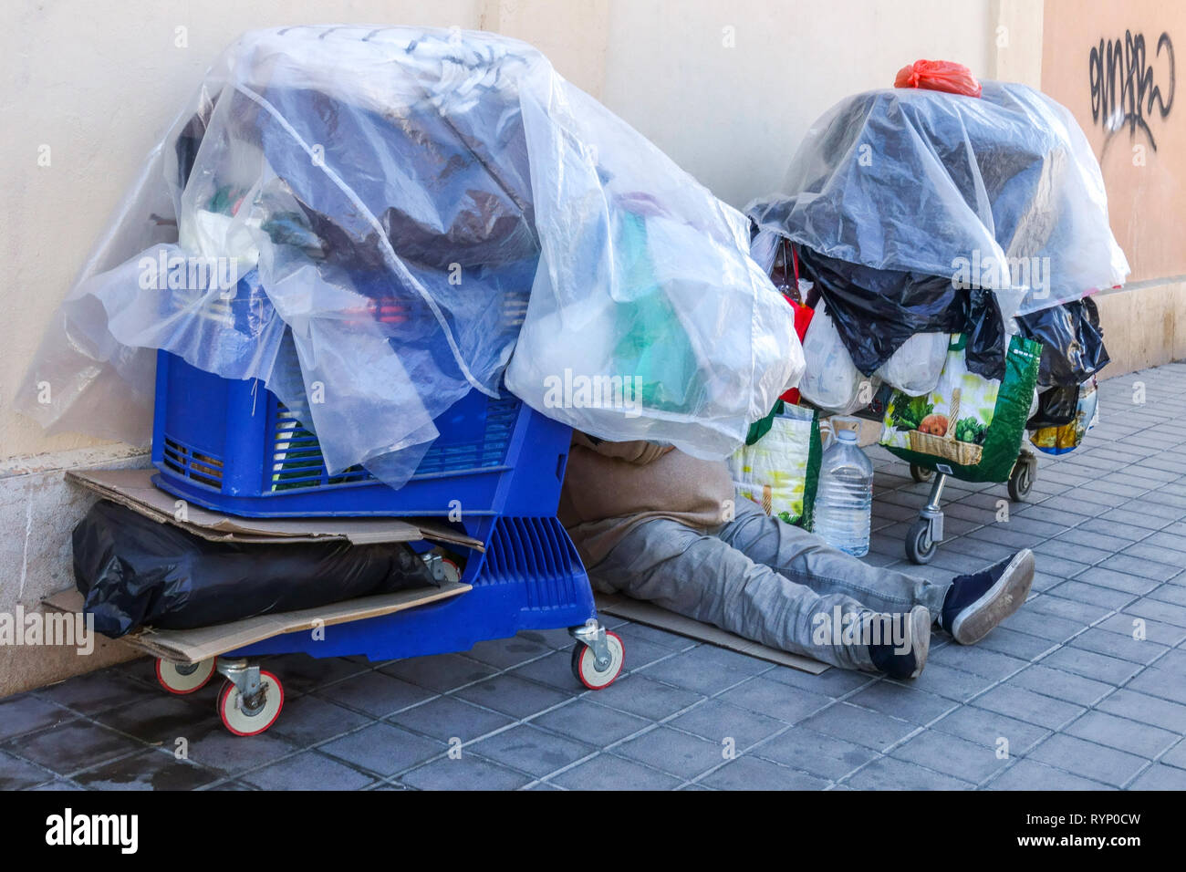 Valencia homeless man on the street with a lot of things, Spanish ...