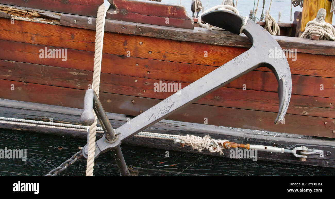 Black anchor from a brown boat on dock in harbour 4K FS700 Odyssey 7Q ...