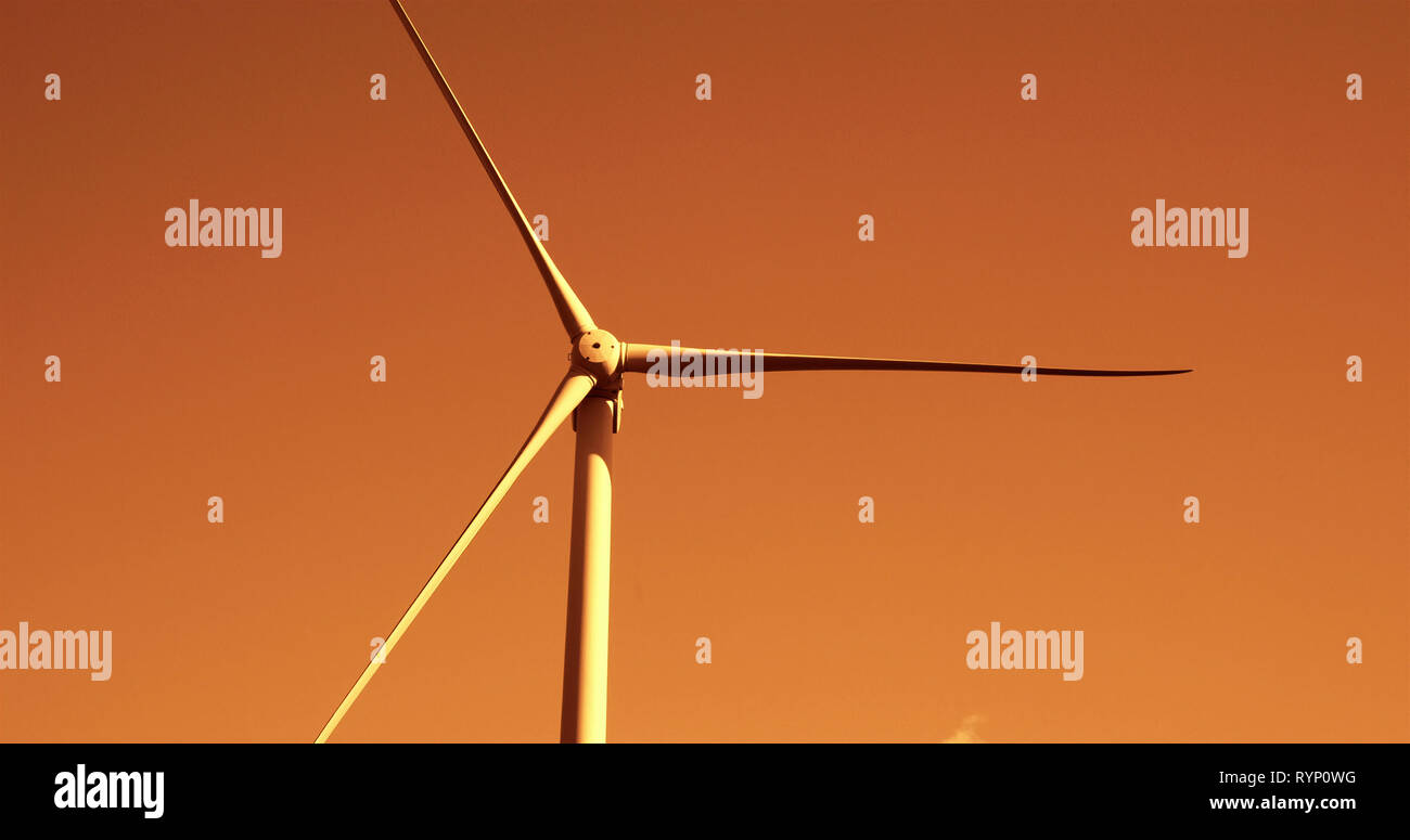 Close up of the three-bladed propeller windmill with the red sky FS700 ...