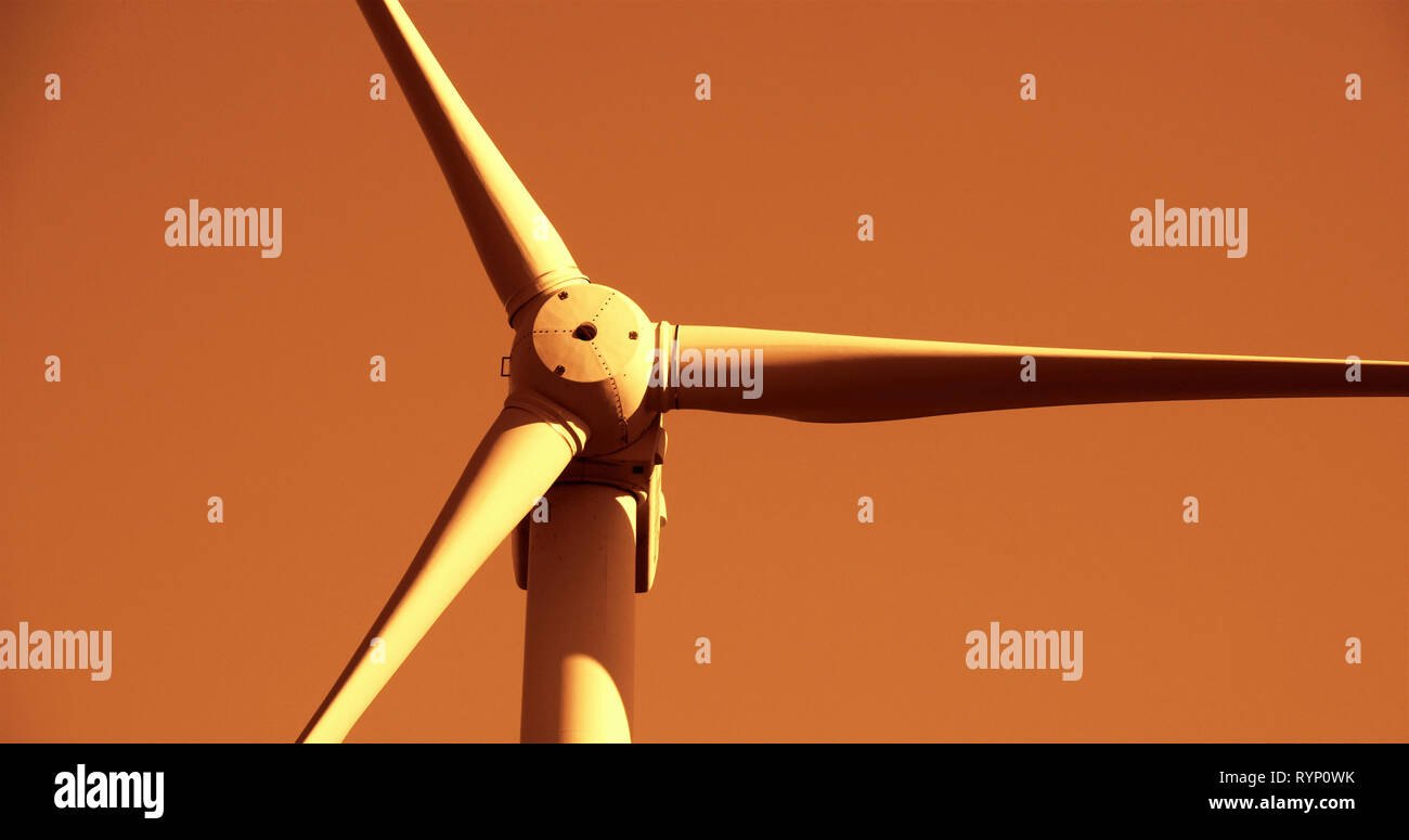 Close up of the three-bladed propeller windmill with the red sky FS700 ...