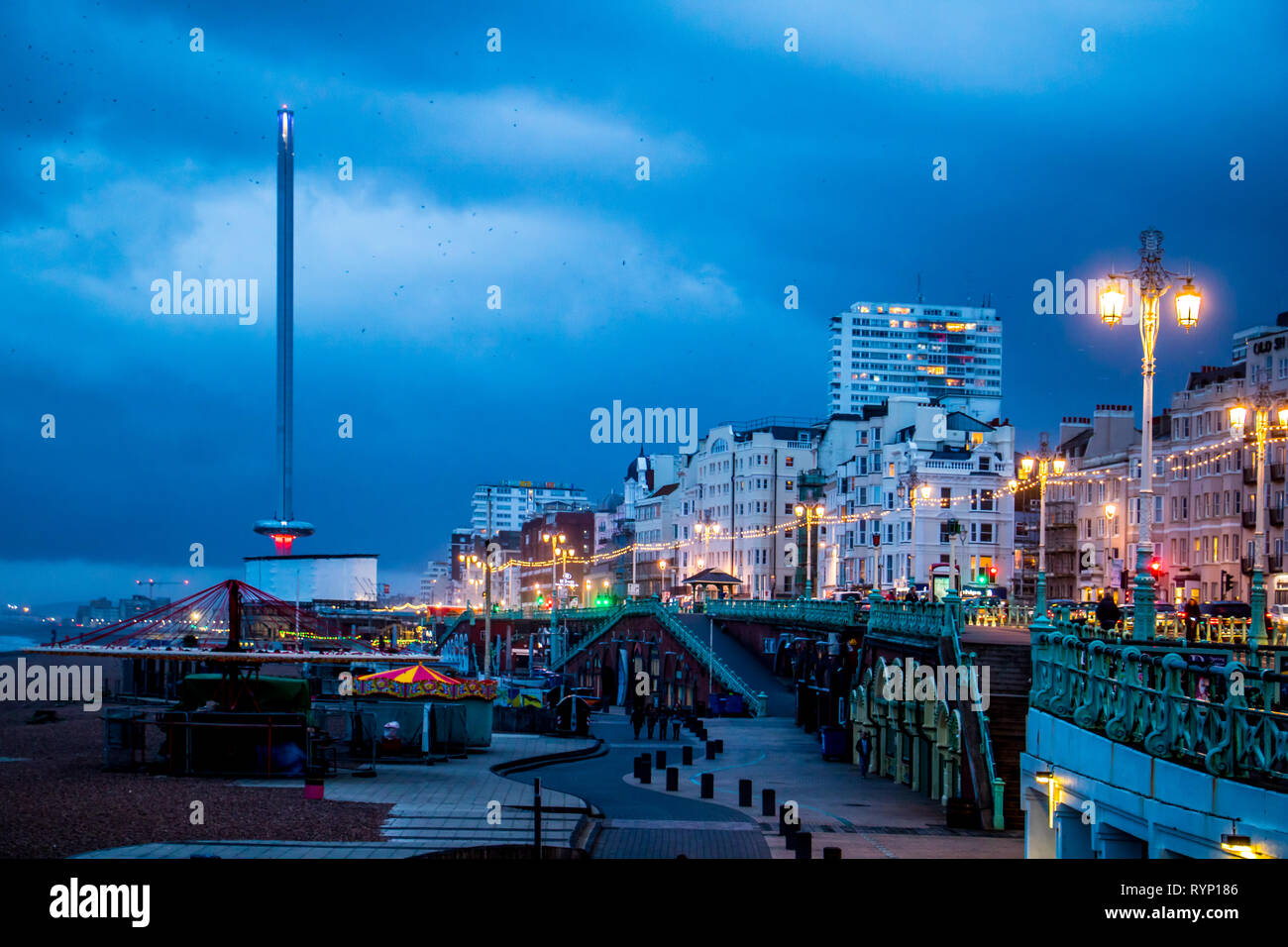 The lights of Brighton seafront in early evening with the British ...