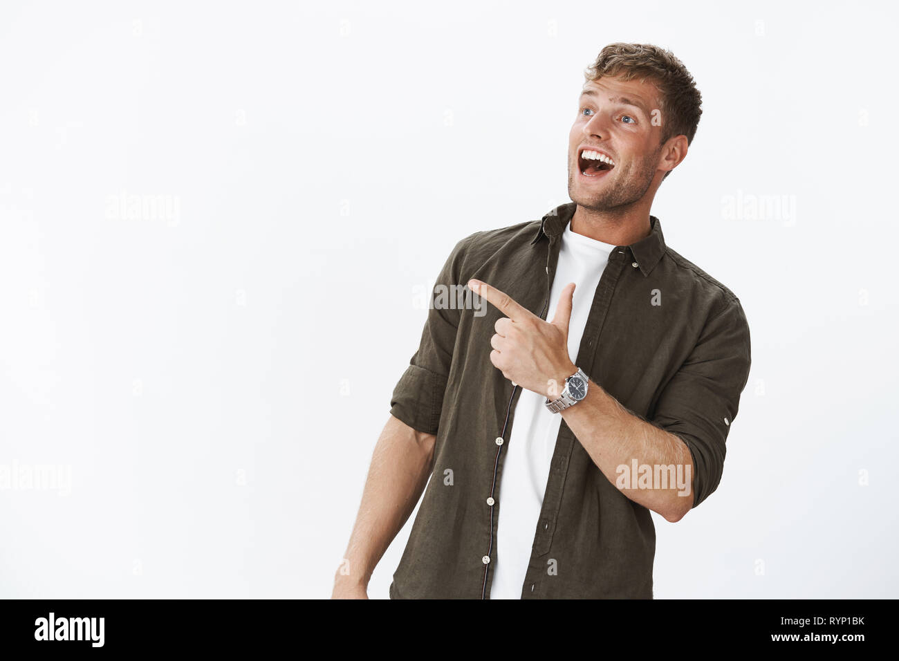 Excited overwhelmed joyful friendly-looking masculine guy with fair ...