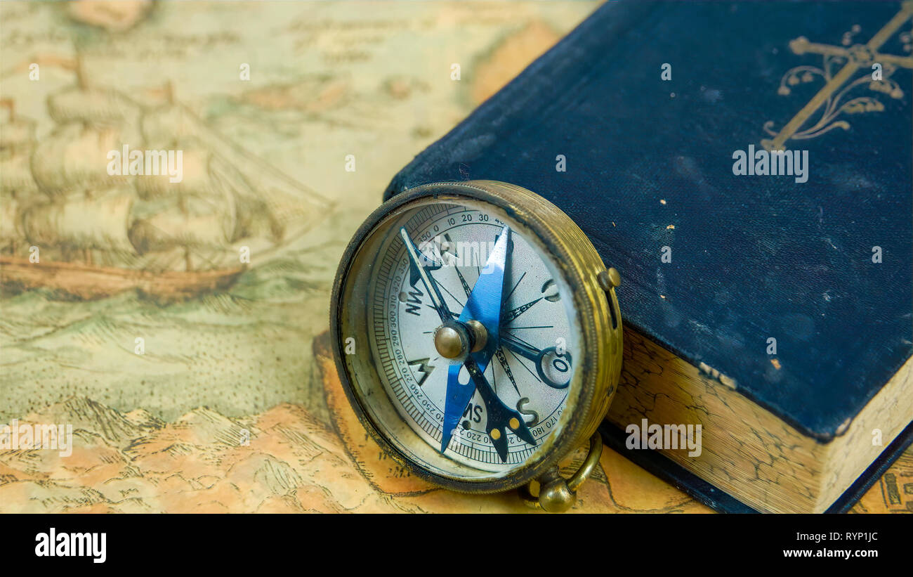 Zoom out view of the compass with the blue book and the navigational ...