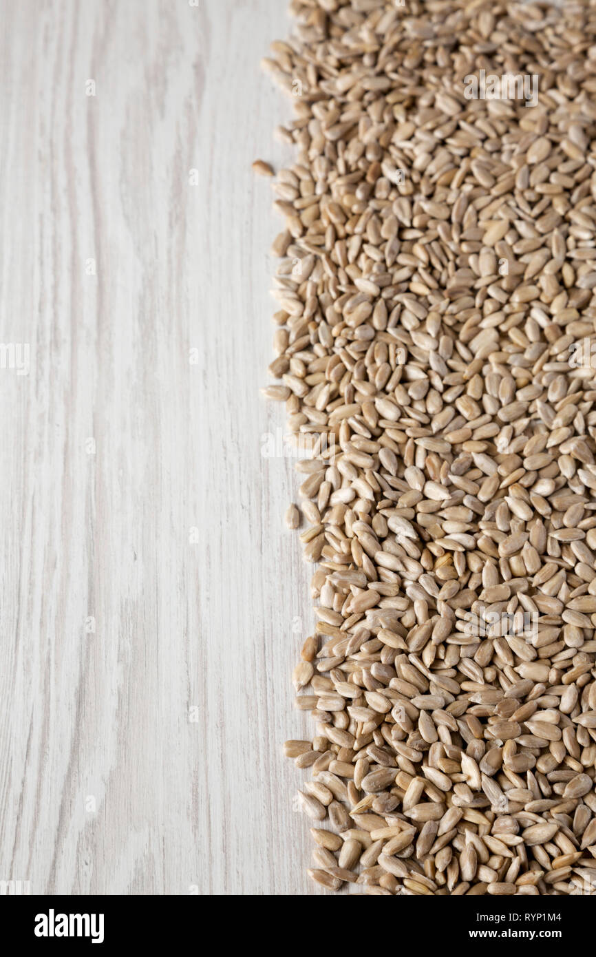 Hulled sunflower seeds, side view. Copy space Stock Photo - Alamy