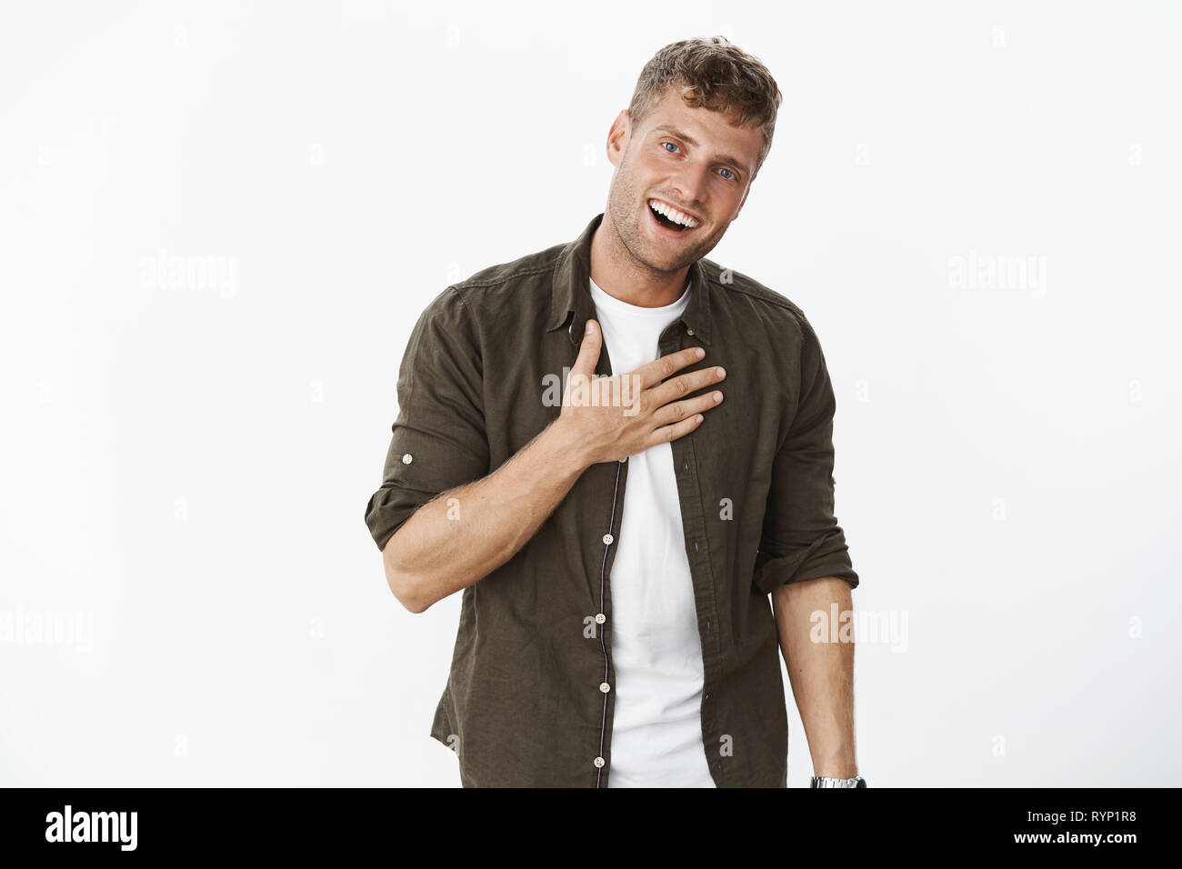 Guy making promise, being honest and speaking from heart holding palm ...