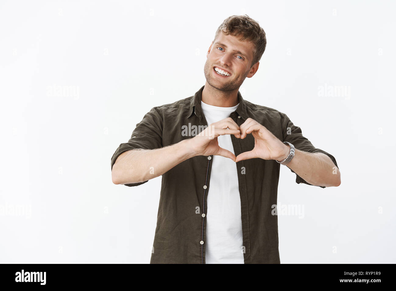 Uplifted with love. Portrait of cute and tender handsome masculine ...