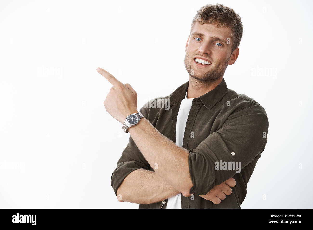 Man pointing left you should take look. Portrait of handsome european ...