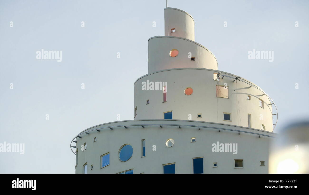 A big spiral shape building it is a white building that can be seen ...