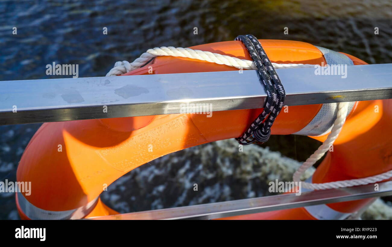 The orange bouy floater on the side of the boat it is an emergency tool ...