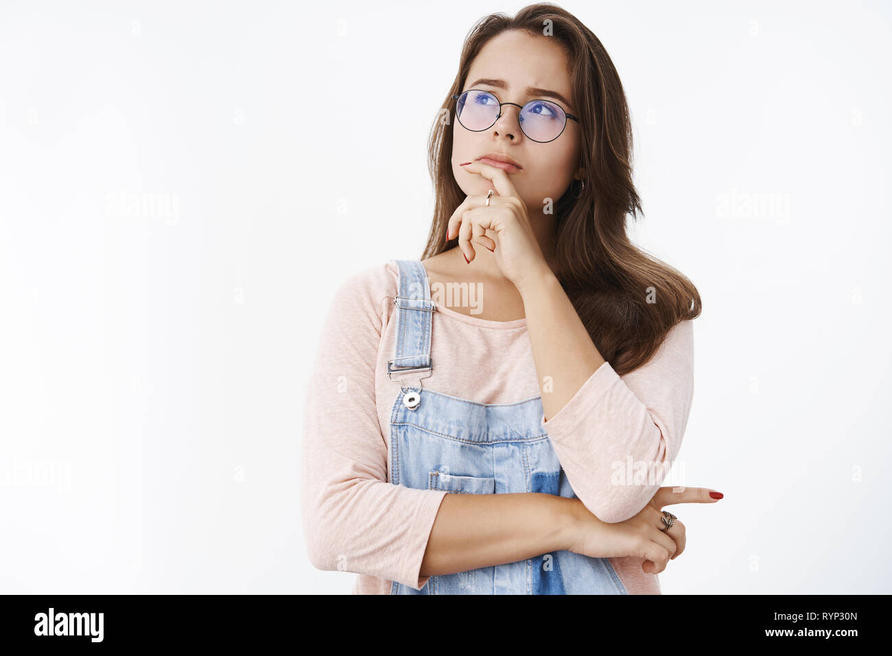 Positive girl thinking solving hi-res stock photography and images - Alamy